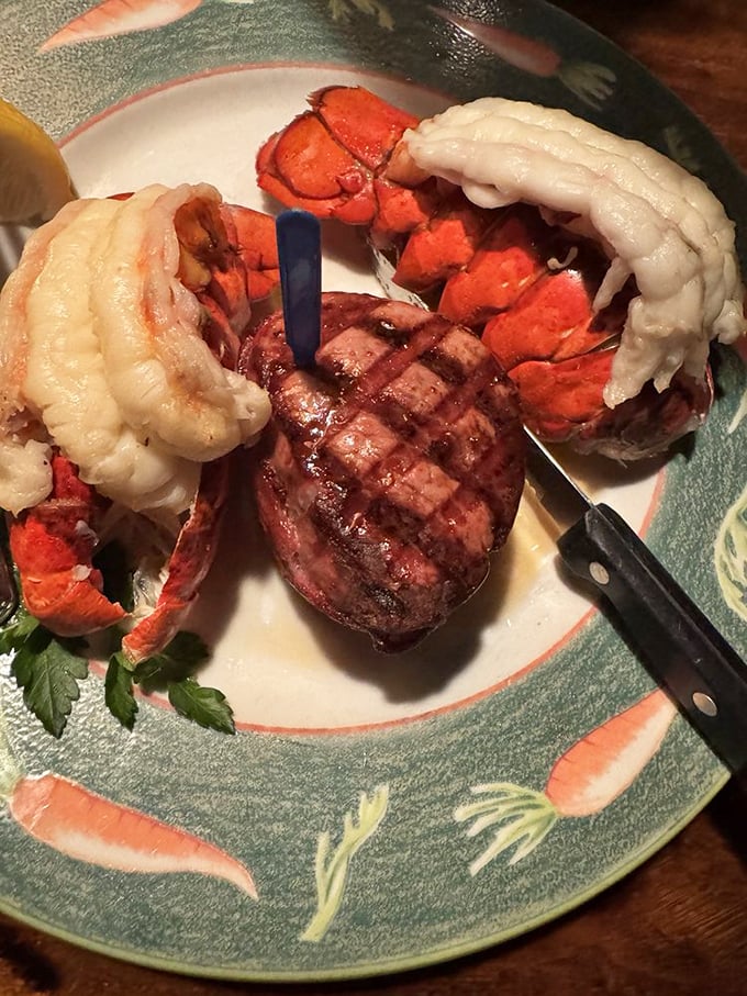 The surf and turf here doesn't whisper, it announces itself like a headline act&mdash;tender filet upstaged only by twin lobster tails that deserve their own spotlight.