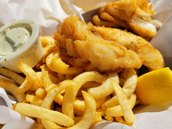 Golden-battered fish atop a bed of crispy fries&mdash;the kind of simple perfection that makes you wonder why anyone would eat fish any other way.