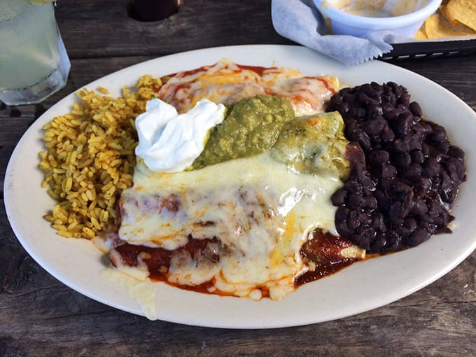 Not all heroes wear capes; some wear melted cheese and come with sides of perfectly seasoned rice and beans. This plate doesn't need Instagram filters.