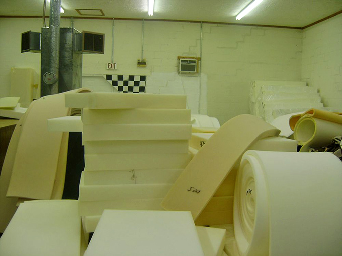The foam rubber room: where cushion dreams and upholstery projects begin their journey from flat rectangles to comfortable reality.