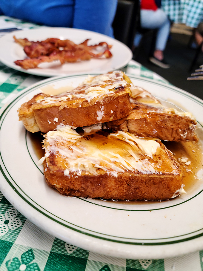 French toast swimming in maple syrup &ndash; where bread transcends to dessert and nobody judges you for it.