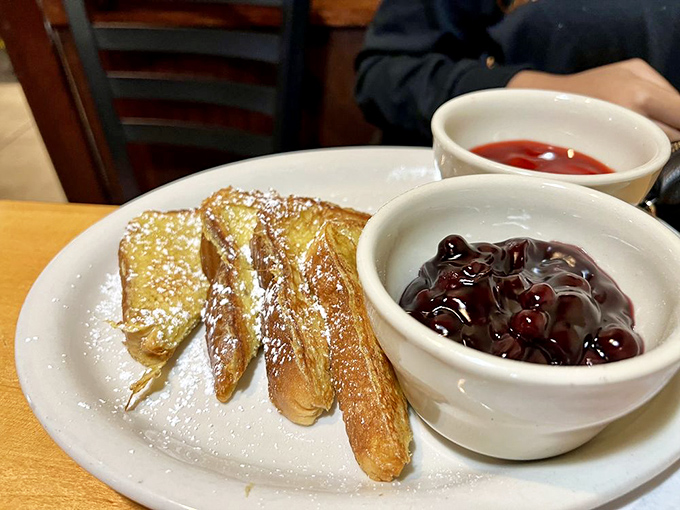 French toast dusted with powdered sugar, served with cherry compote that's tart enough to cut through the sweetness. Breakfast or dessert? Yes.
