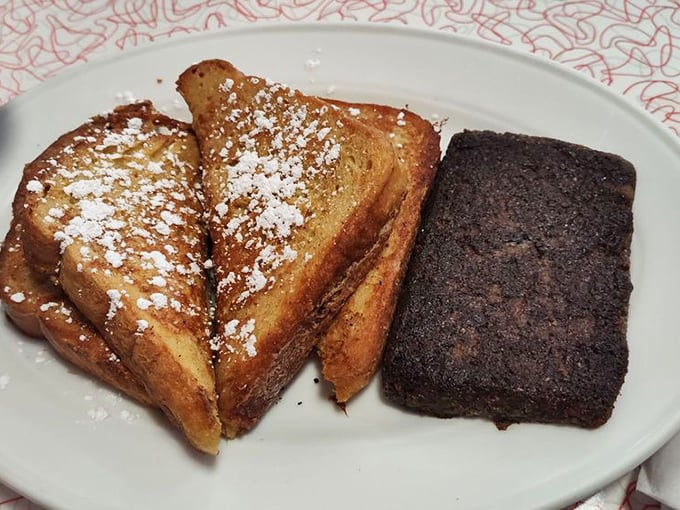 French toast so perfect it deserves its own ZIP code. That powdered sugar sprinkle is the morning equivalent of fairy dust.
