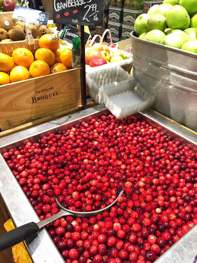 Fresh cranberries waiting to become something magnificent, like tiny rubies in a treasure chest of produce. Nature's candy at its finest.