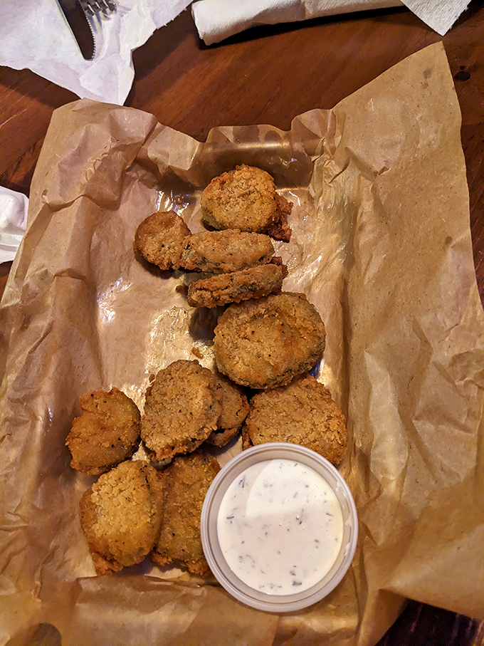Fried pickles: proof that anything dipped in batter and kissed by hot oil becomes an irresistible delicacy. The dipping sauce is just a bonus.