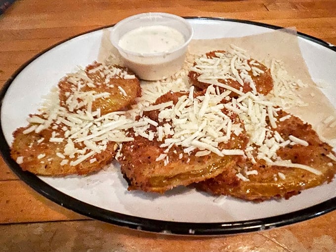 Golden discs of Southern comfort &ndash; these fried green tomatoes with their crispy coating and melty cheese topping offer a moment of crispy-creamy perfection.