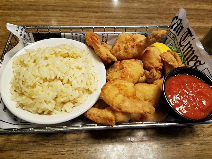 This basket of golden-fried shrimp nested on a bed of crispy fries isn't just dinner&mdash;it's therapy wrapped in newspaper with a side of tartar sauce.