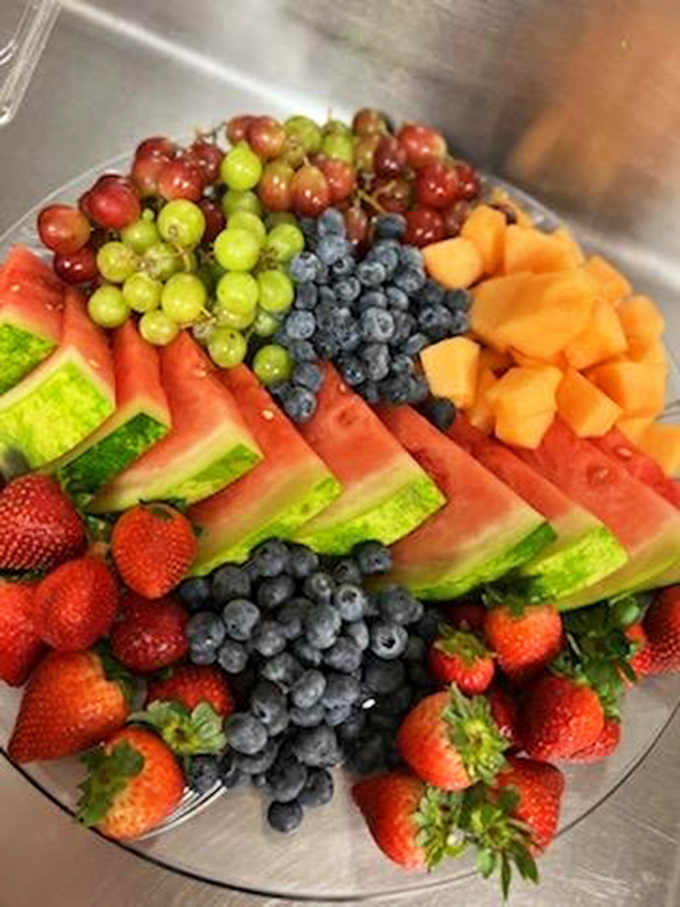 The fruit display offers a moment of virtuous eating before returning to the more serious business of dessert.