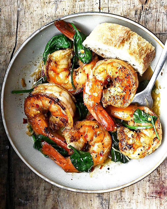 Garlic butter shrimp that's having a moment with fresh spinach. This dish doesn't just speak to you&mdash;it serenades.