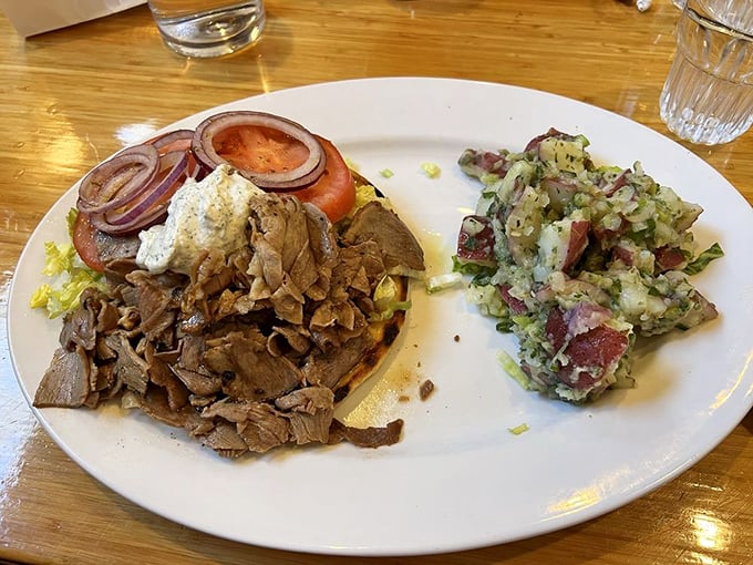 Not just potato salad &ndash; a Greek masterpiece. Those red bits aren't just tomatoes; they're little flavor bombs waiting to detonate on your taste buds.