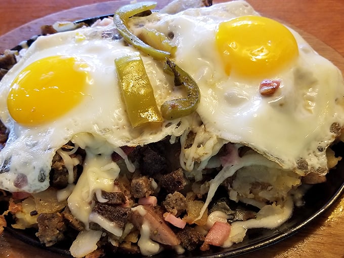 Breakfast with altitude! This hearty skillet creation layers flavors like a delicious archaeological dig, crowned with those perfect sunny-side-up eggs.