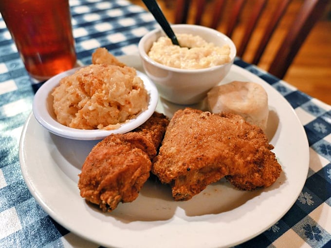 Fried chicken so perfectly golden it belongs in Fort Knox, accompanied by sides that refuse to be overshadowed by the main attraction.