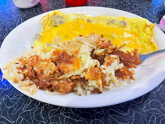 That golden cheese omelet with perfectly crisped hash browns reminds us that breakfast's greatest hits don't need autotune&mdash;just a well-seasoned griddle.