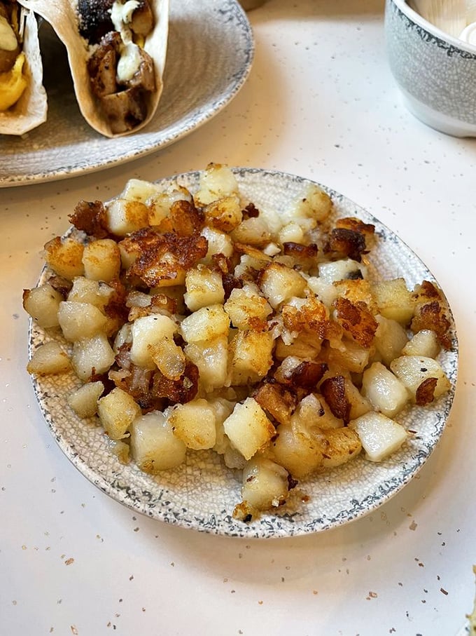 These golden-brown hash browns achieve what politicians can't: perfect balance between crispy exterior and tender interior, with universal appeal.