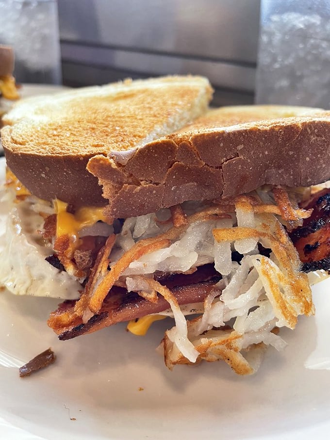 The Haystack sandwich&mdash;where grilled bread meets melted cheese, crispy bacon, and grilled onions in a summit of comfort food diplomacy.
