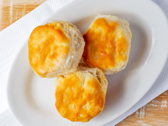 These aren't just biscuits—they're buttery time machines to your grandmother's kitchen, golden-topped and ready for their close-up.