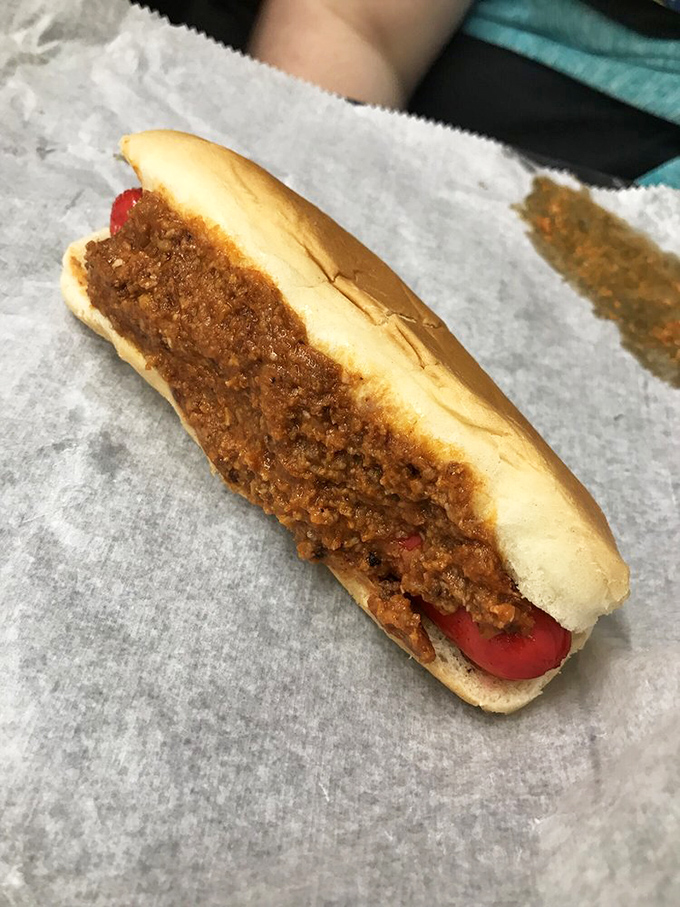 The hot dog with chili speaks a universal language of comfort that crosses all demographic lines.