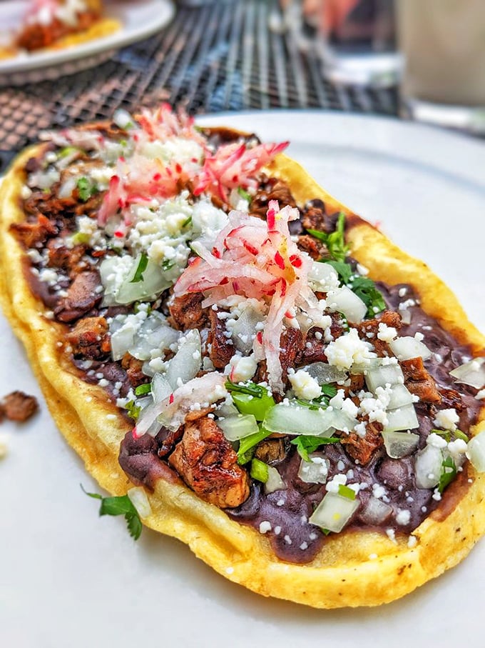 The huarache&mdash;Mexico's answer to flatbread&mdash;creates the perfect foundation for a mountain of beans, meat, cheese, and those magical pickled red onions.