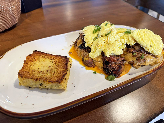 Breakfast architecture at its finest: a loaded biscuit alongside a green chile grit cake that would make a Southern grandmother nod in approval.