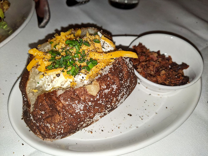 Not just any potato&mdash;a loaded masterpiece topped with cheese, bacon, and chives that makes you wonder why you'd ever eat vegetables.