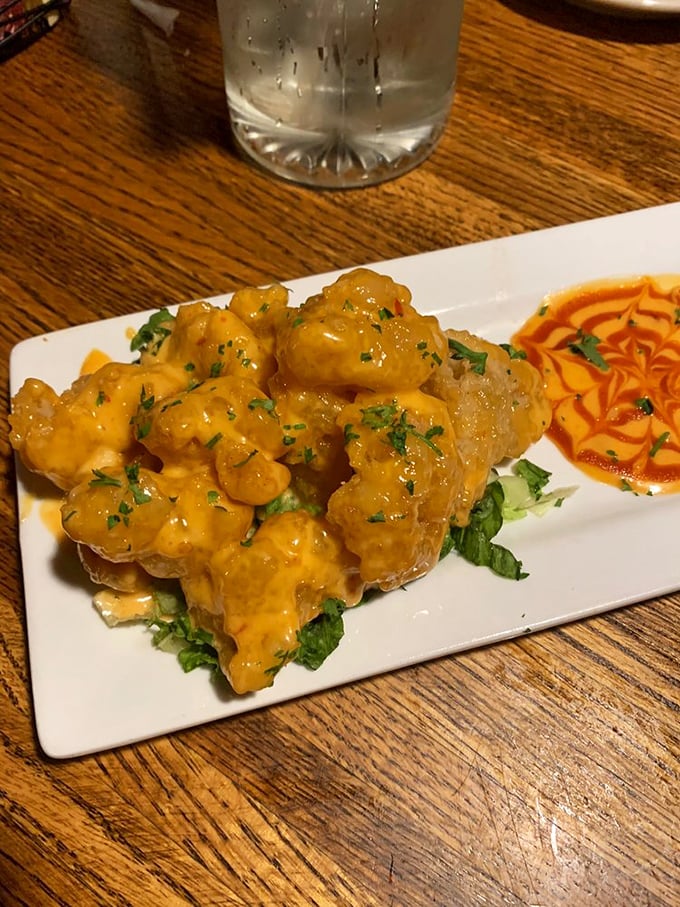 These golden-battered shrimp bathed in spicy sauce aren't just an appetizer&mdash;they're the opening act that threatens to upstage the headliner.