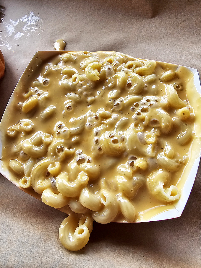 Mac and cheese so creamy it should be illegal in at least nine states. This isn't just comfort food&mdash;it's a warm hug for your taste buds.