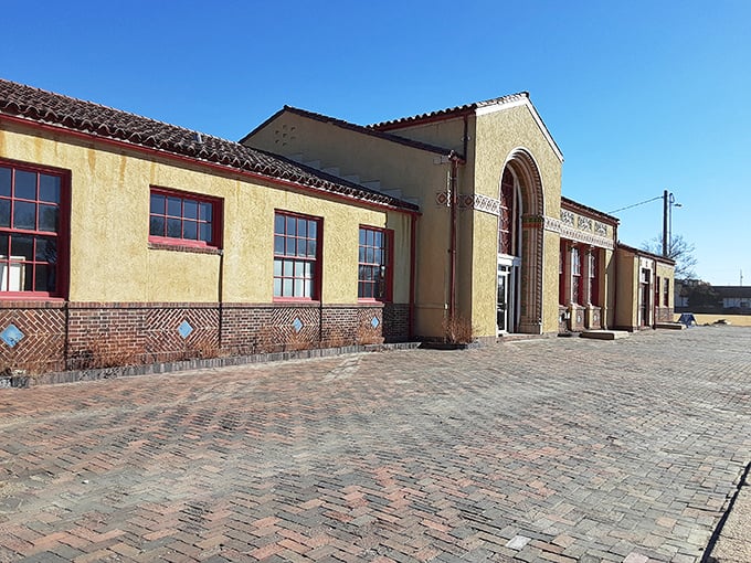 The Union Pacific Depot's Spanish-style architecture stands as an unexpected surprise amid the prairie landscape. Its brick pavers have welcomed travelers for generations.
