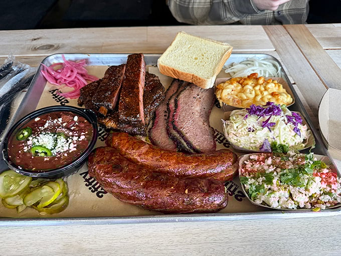 This isn't just a tray&mdash;it's a greatest hits album of smoked meats. The bread is just there to remind you that civilization still exists outside this meat paradise.