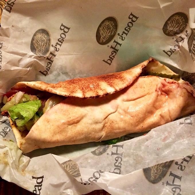 This wrap isn't just food&mdash;it's edible architecture. The perfectly toasted exterior cradles a garden of freshness within, all nestled in paper like a precious gift.