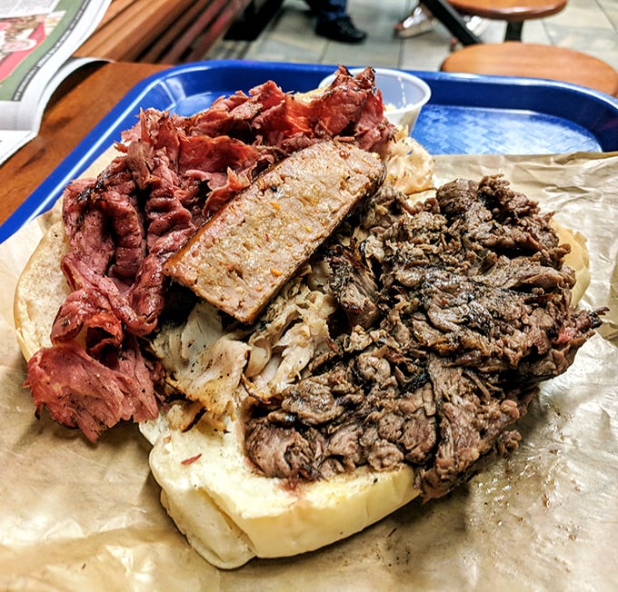 The indecision-solver: a glorious trinity of meats sharing real estate on a roll that somehow manages to contain all that smoky magnificence.