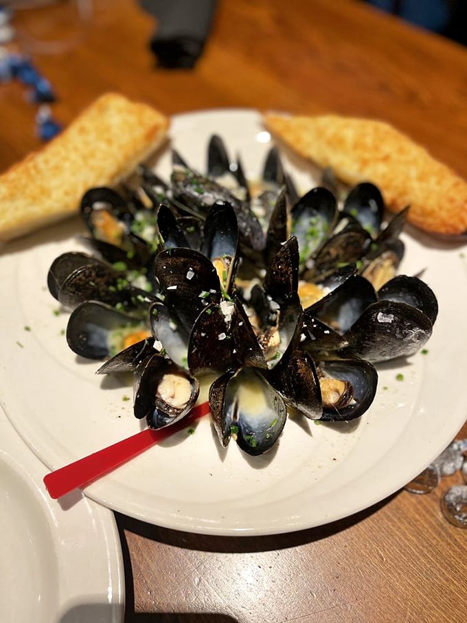 These mussels aren't just opened, they're performing&mdash;a maritime chorus line of briny perfection with crusty bread standing by for the encore.