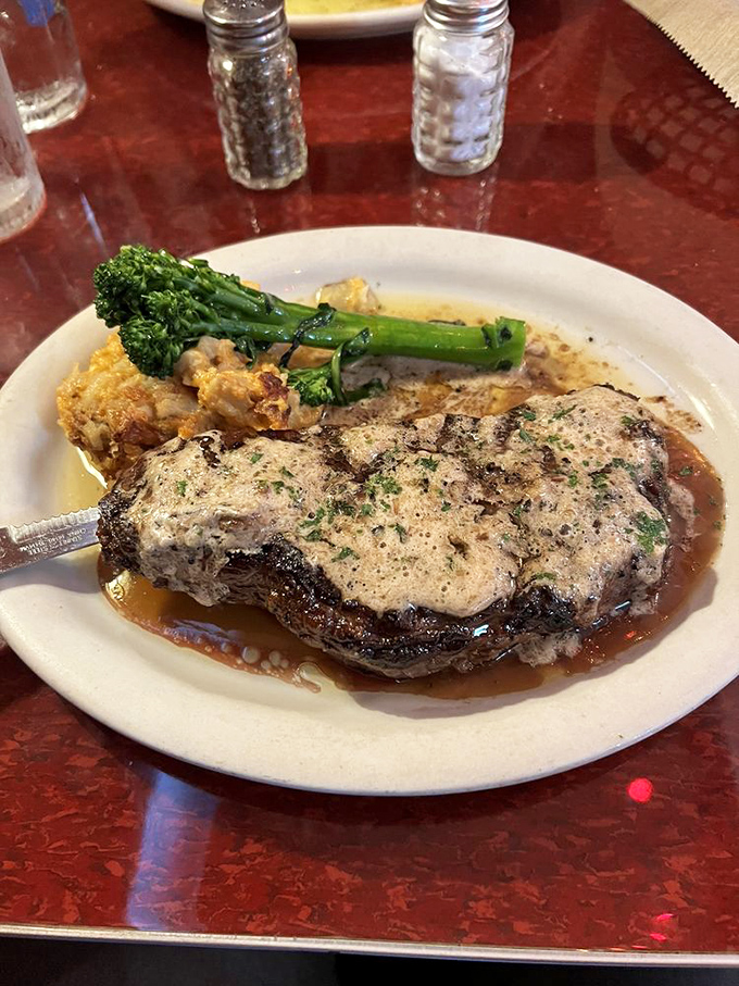 When a steak comes with its own river of sauce and a crown of herb butter, you know you're not in fast-food territory anymore.