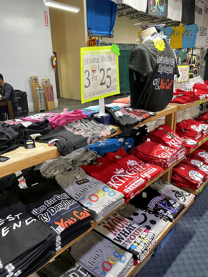 The "3 for $25" funny t-shirt display&mdash;where dad jokes achieve immortality through cotton and clever typography.