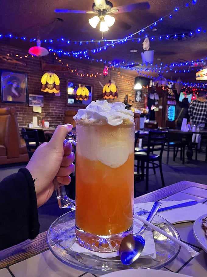 This orange cream float isn't just a drink, it's time travel – childhood nostalgia meets adult privileges in one gloriously excessive glass.