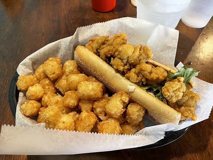 Not just a sandwich, but an architectural marvel of crispy seafood, fluffy bread, and perfect proportions. Engineering you can eat.