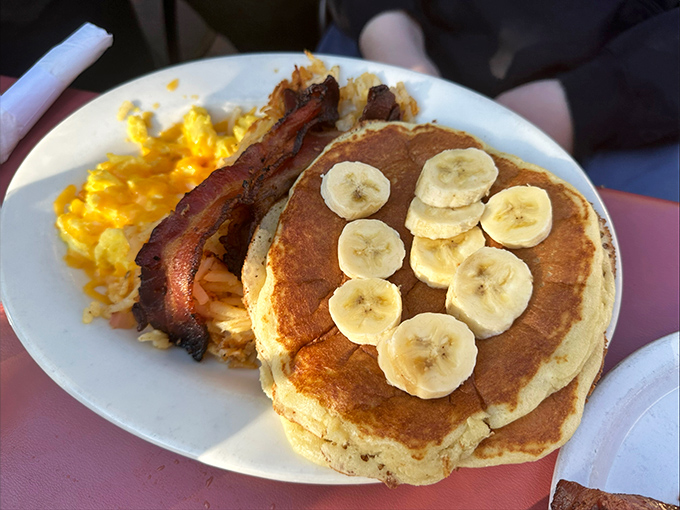These pancakes don't need a mountain view&mdash;they ARE the view. Golden discs of joy topped with banana slices like edible sunshine.