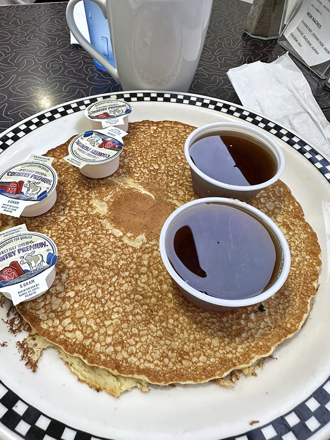 Pancakes the size of vinyl records, with butter melting like a hit song on the charts. Add syrup and suddenly you're conducting a sticky symphony.