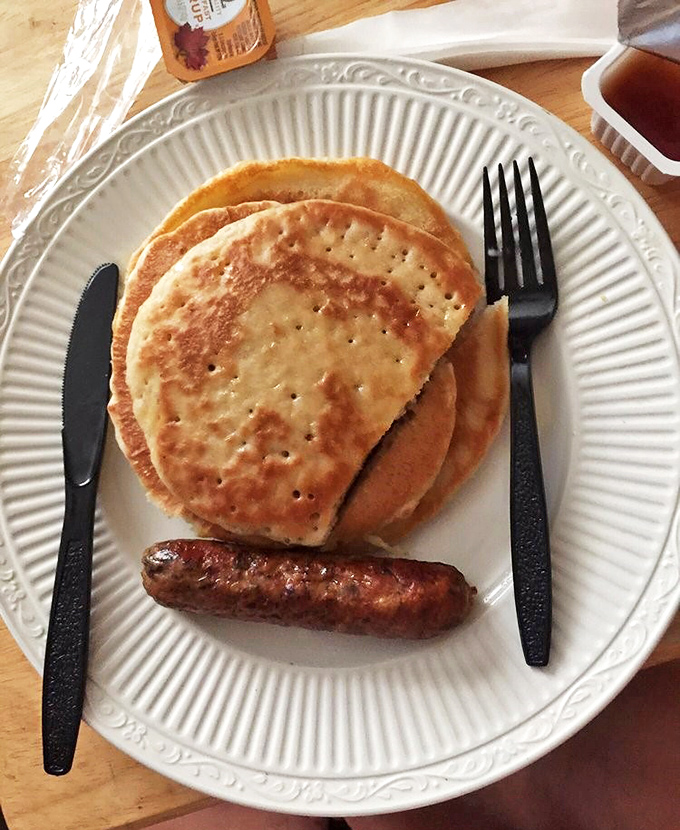 Pancakes with the perfect bronze tan, stacked high like flapjack poker chips. That sausage isn't just along for the ride.