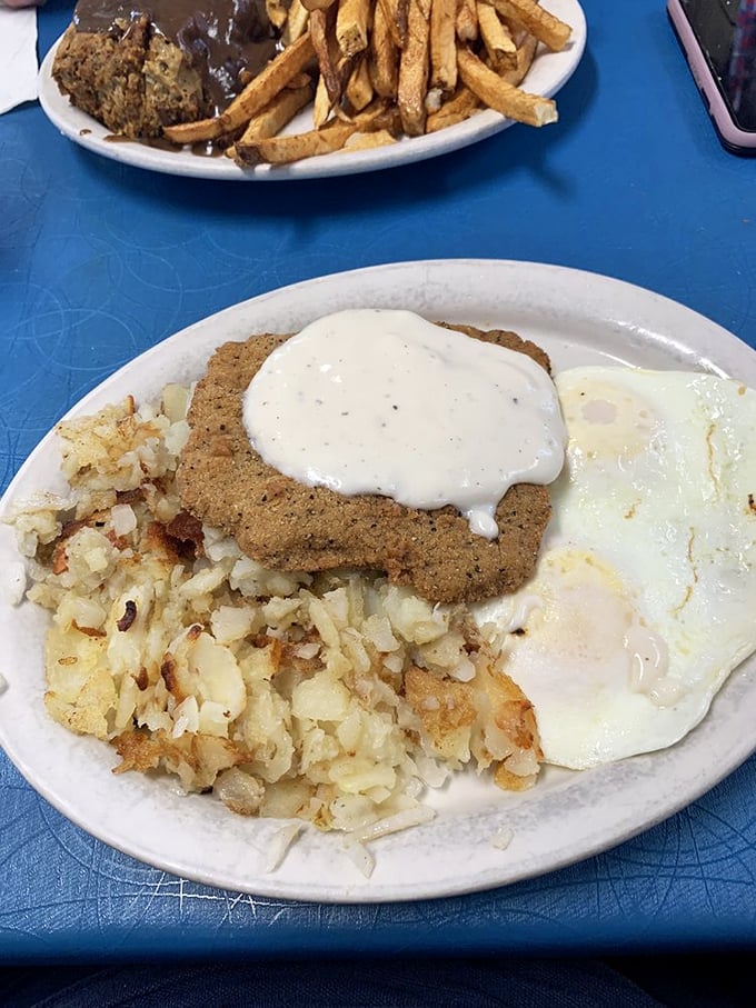 Country-fried steak with gravy, eggs, and hash browns—the holy trinity of diner breakfasts that laughs in the face of modern food trends.