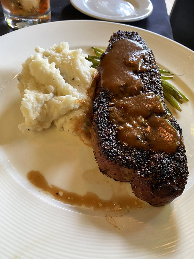 Cozy wood-paneled interiors create that perfect "neighborhood gem" atmosphere. The kind of place where memories are made between bites.