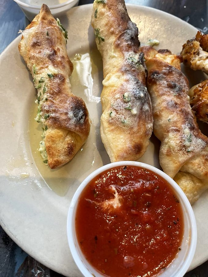 These aren't your average breadsticks. Stuffed with herbs and cheese, these wood-fired rolls are what garlic knots dream of becoming when they grow up.