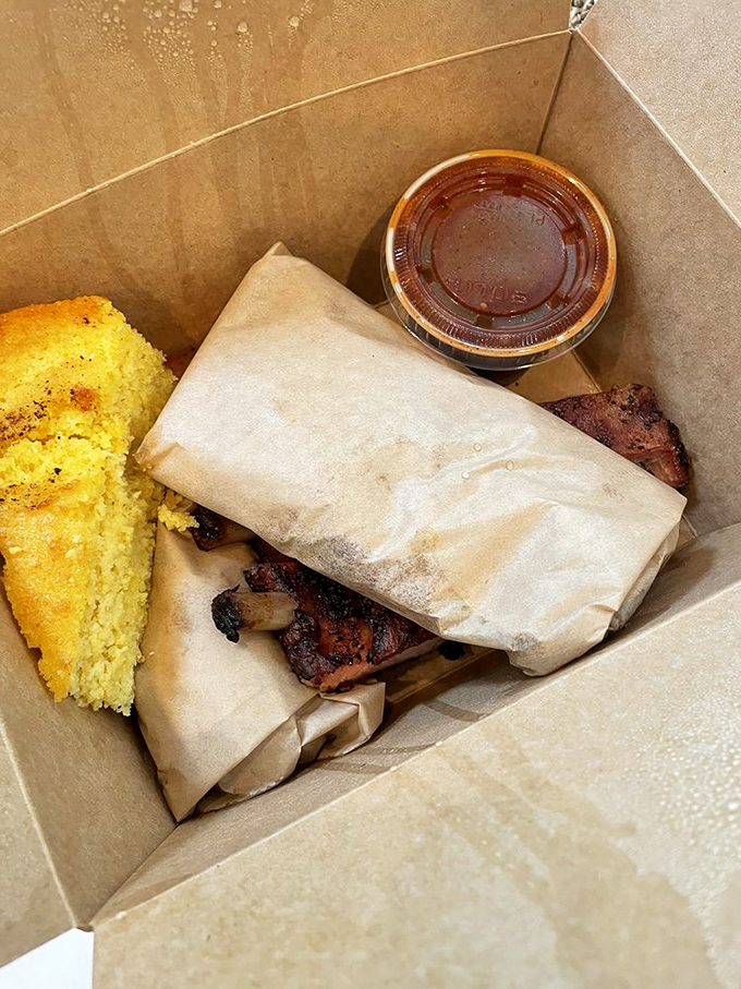 Even takeout maintains the integrity of the smoke&mdash;cornbread, sauce, and meat nestled in a box that should come with a warning: "May induce food coma."