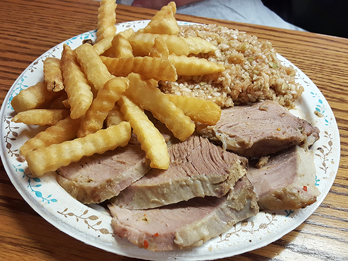 Every great plate of barbecue begins like this. Pork shoulders awaiting their hickory-smoked destiny in a dance as old as time.