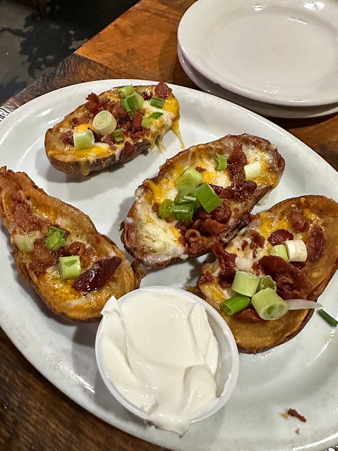 Loaded potato skins: where cheese, bacon, and green onions throw the kind of party your taste buds won't stop talking about.
