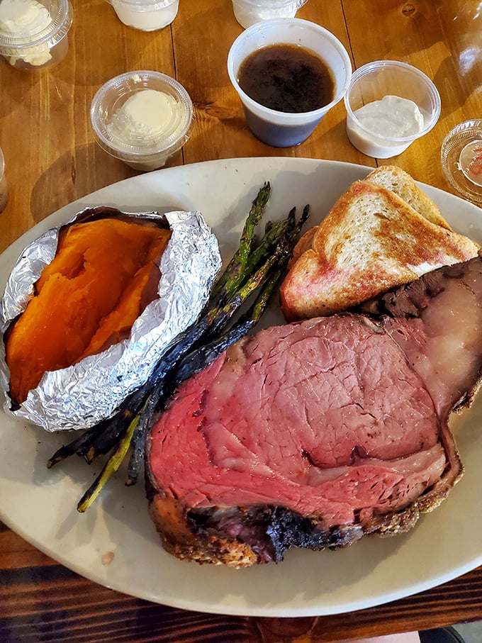 Prime rib so tender it practically surrenders to your fork, paired with a sweet potato that's having its own little foil-wrapped spa day.