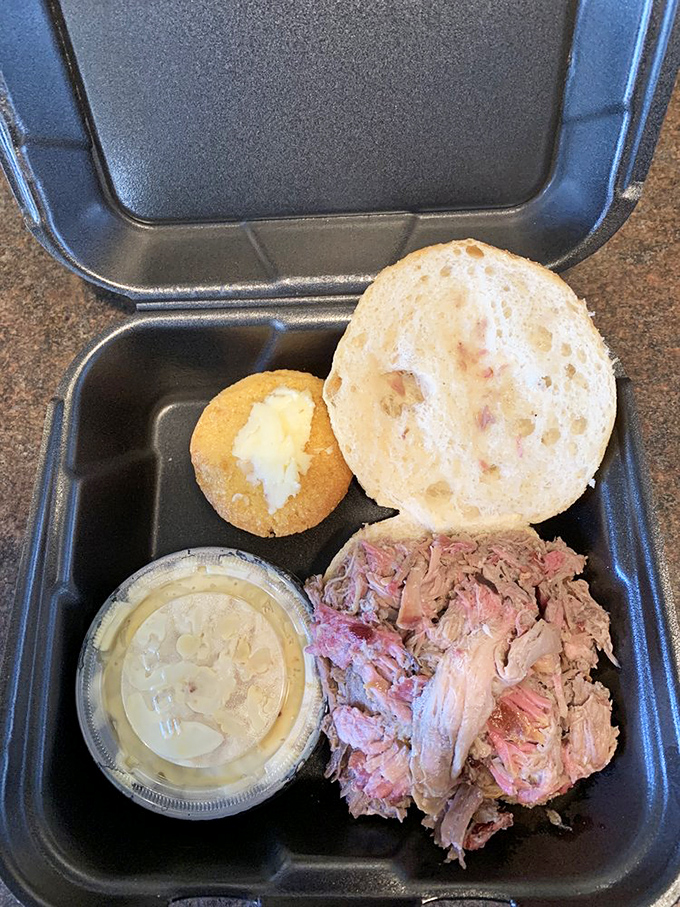 Pulled pork perfection in its most honest form&mdash;tender strands of smoky pork shoulder cradled in a soft roll with just the right sauce-to-meat ratio.