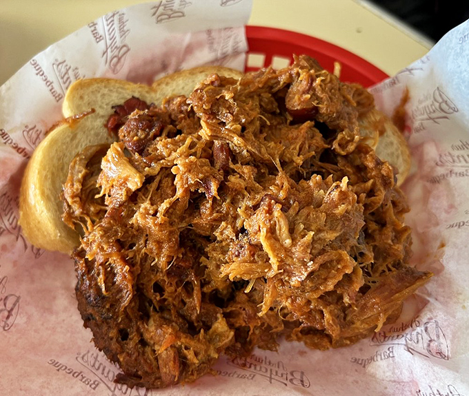 This pulled pork sandwich isn't just a meal&mdash;it's a mountain of smoky, tender meat that makes white bread perform its highest calling.
