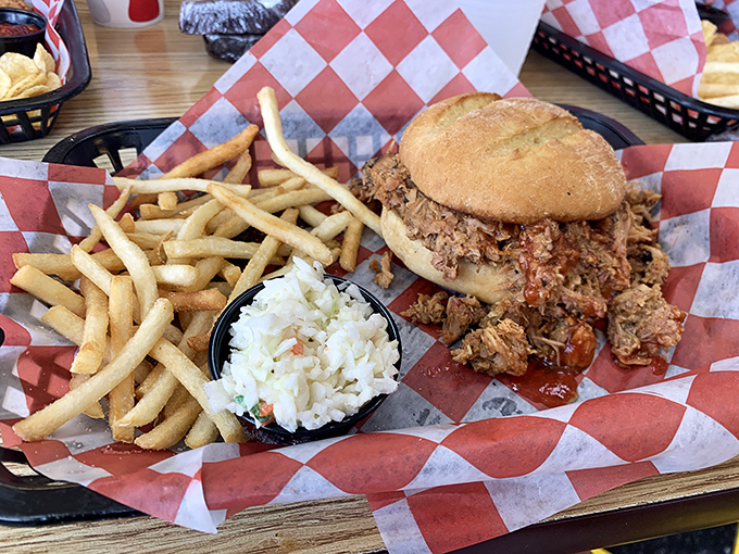 A pulled pork sandwich that requires both hands and several napkins. The overflow isn't poor planning&mdash;it's generosity you can taste.