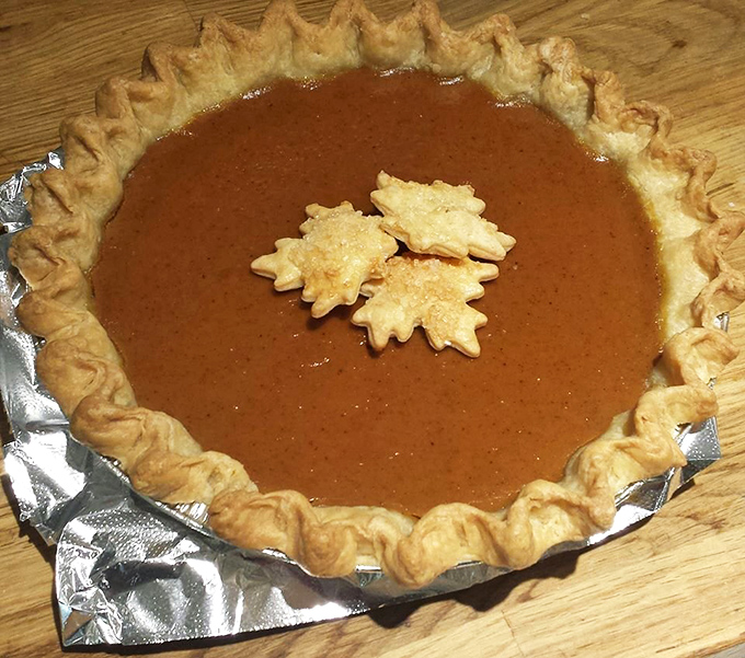 This pumpkin pie isn't just seasonal &ndash; it's wearing little pastry maple leaves like a fashionable fall accessory.