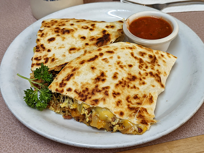 Quesadillas that crackle with each bite, revealing a treasure of melted cheese and fillings that would make any abuela proud.